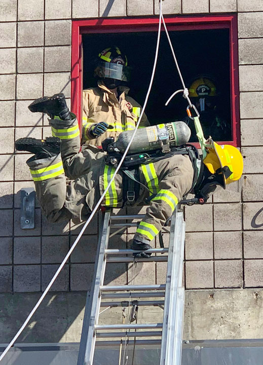 Fire department recruits being put through the paces