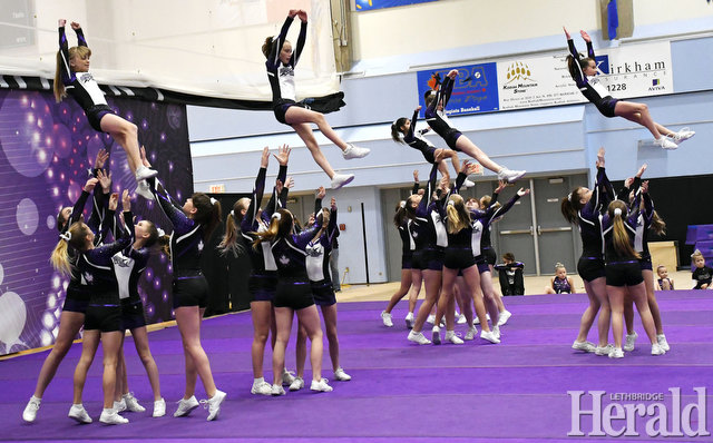 High flying cheerleaders showcase teamwork skills