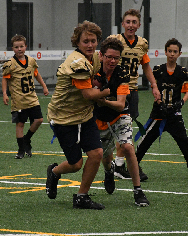 Flag football clinic teaches skills and working together