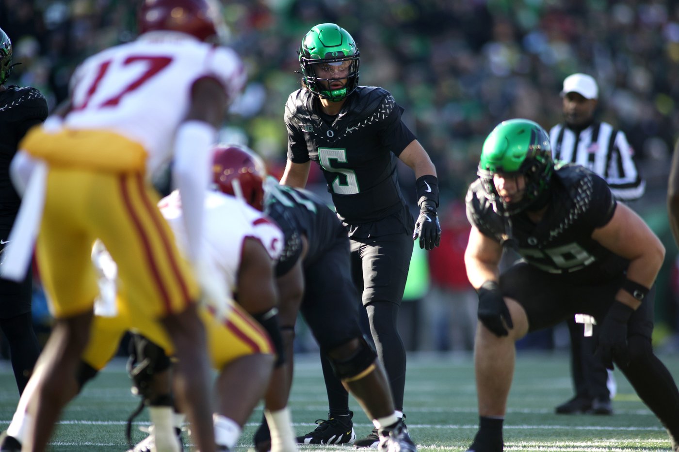 Moore throws 2 TD passes and No. 6 Oregon derails No. 16 USC's CFP hopes with a 42-27 win